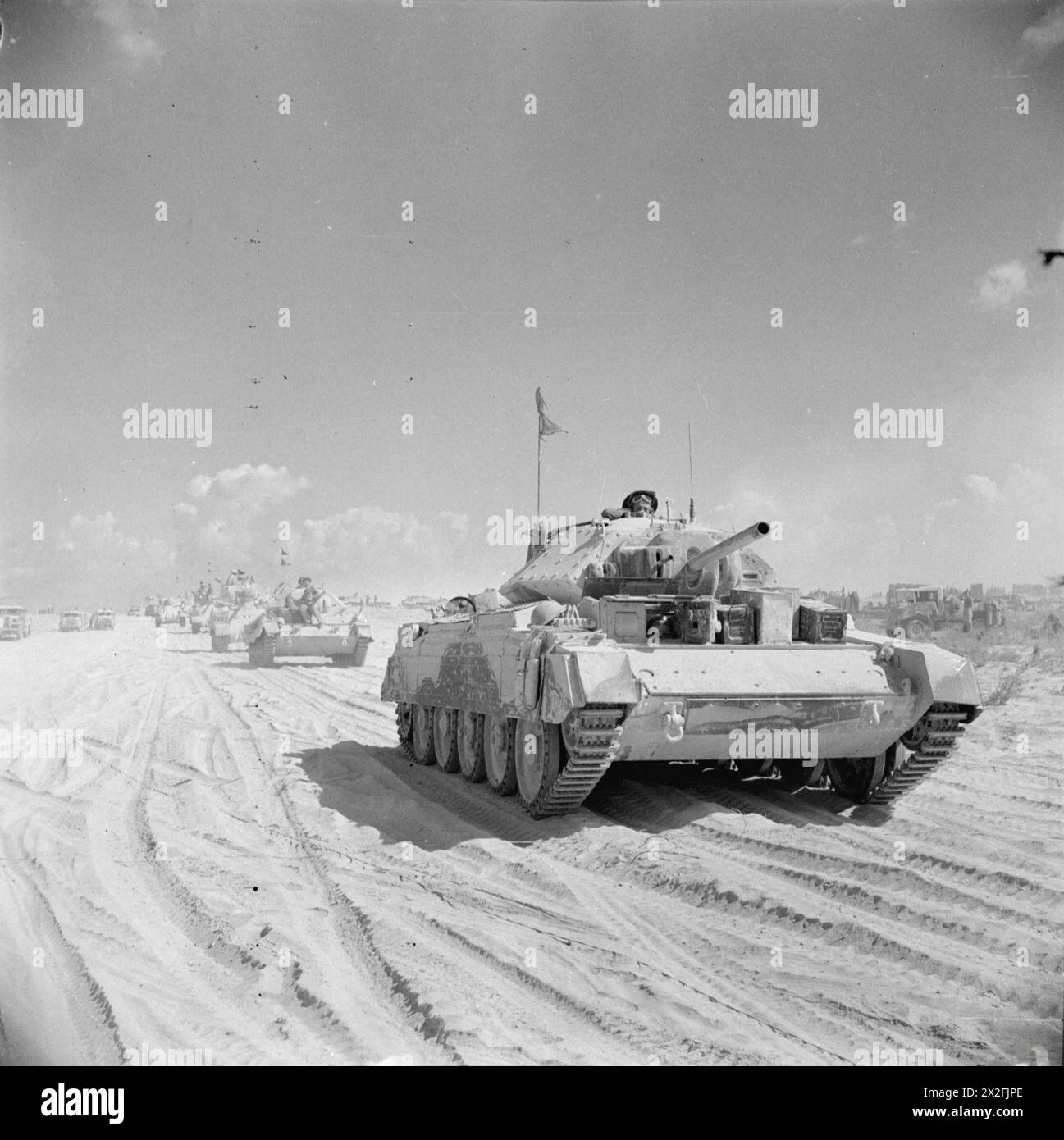 SECOND WORLD WAR - A line of Crusader and Sherman tanks move up the ...