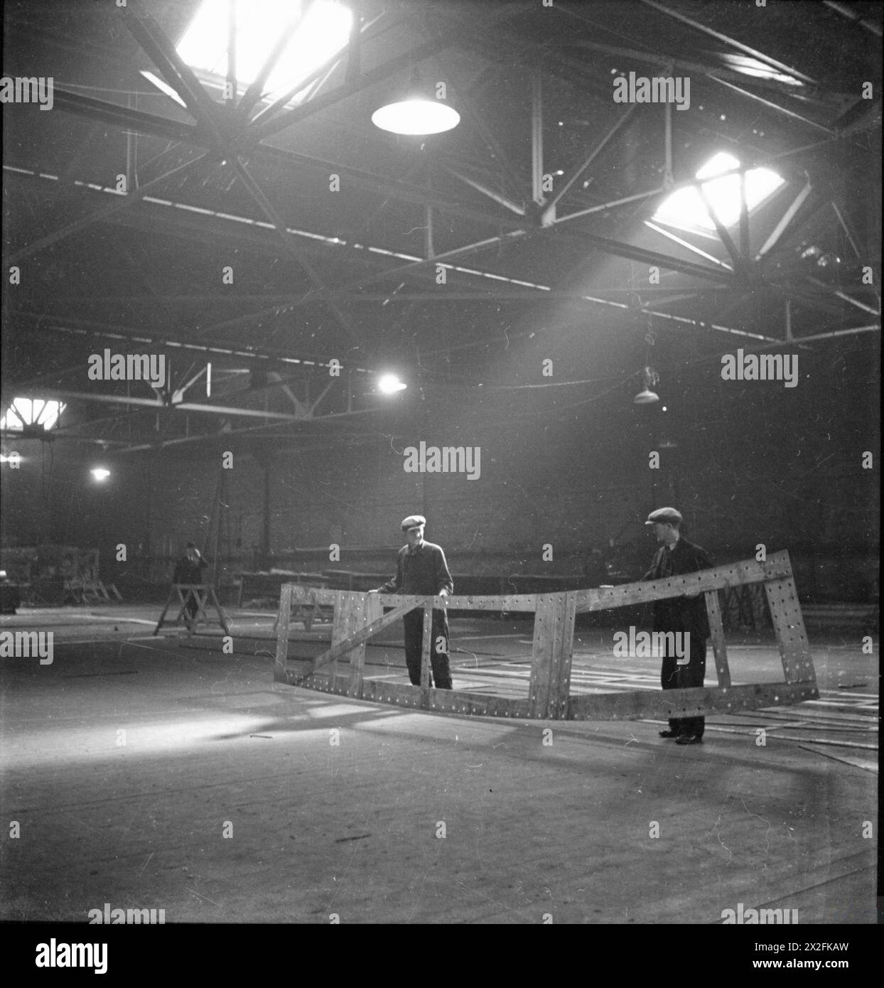 Photograph by Cecil Beaton at Tyne Shipyards in 1943 showing two men ...