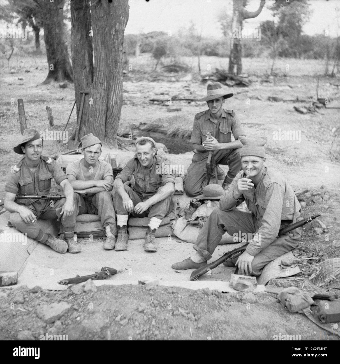 THE BRITISH ARMY IN BURMA 1945 - Men of IV Corps, 20th Division, rest ...