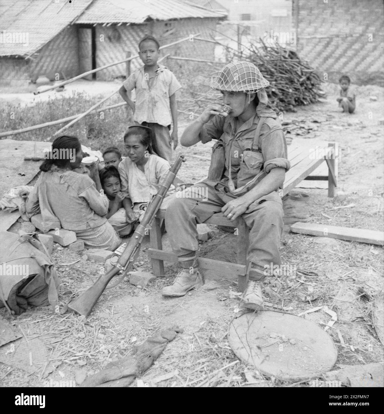 THE BRITISH ARMY IN BURMA 1945 - A Burmese family living in a dug-out ...