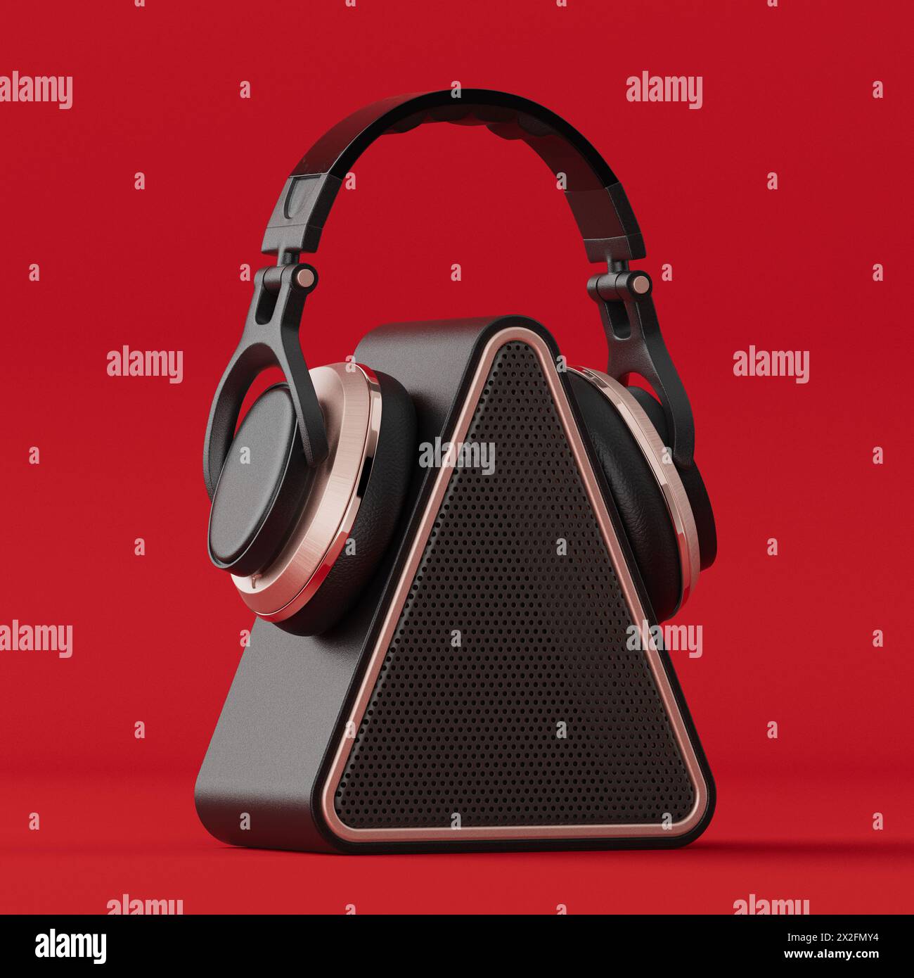 Modern Triangular Mobile Music Speaker with Headphones on a red ...