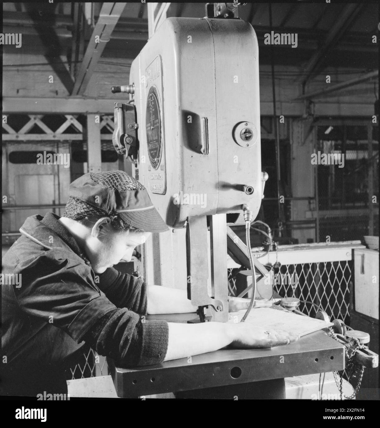 In 1942, a woman war worker in a British marine engineering shop ...