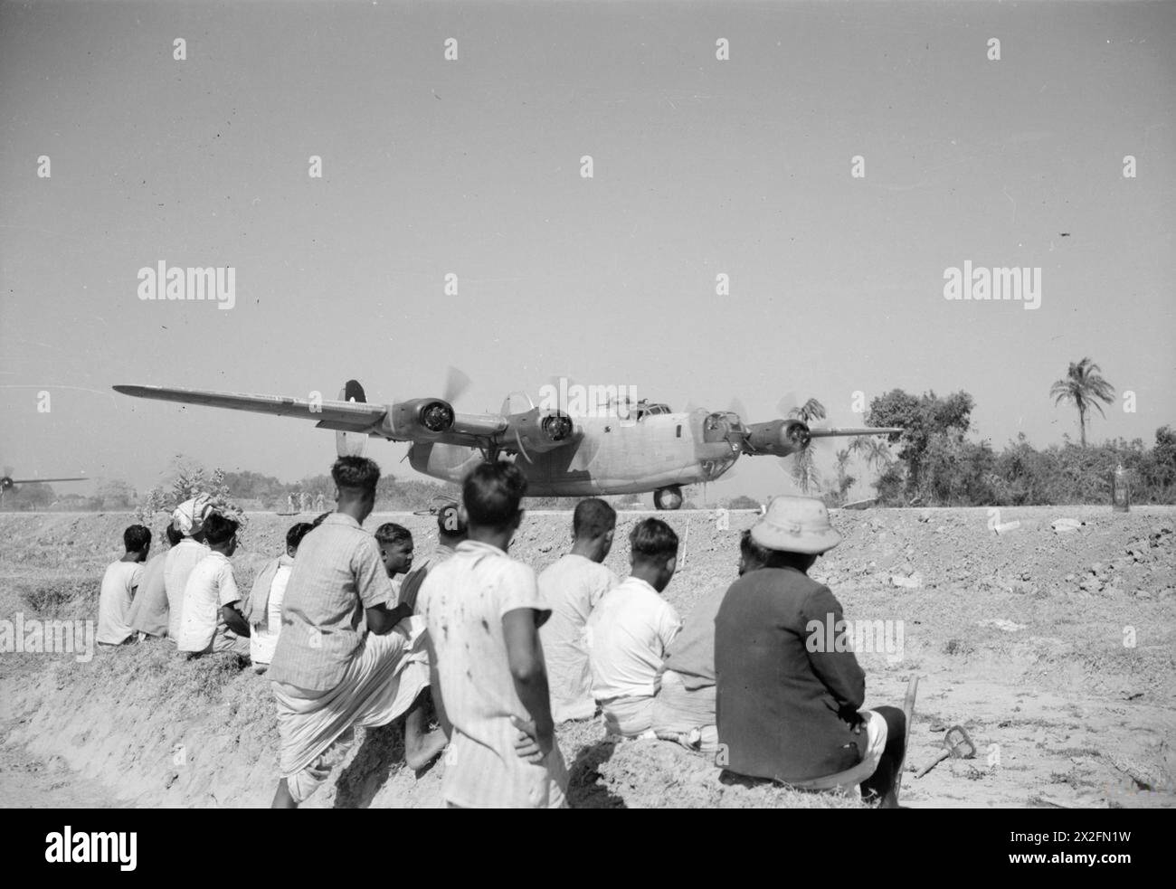 ON AN R.A.F. LIBERATOR STATION IN INDIA - Picture (issued 1945) shows ...