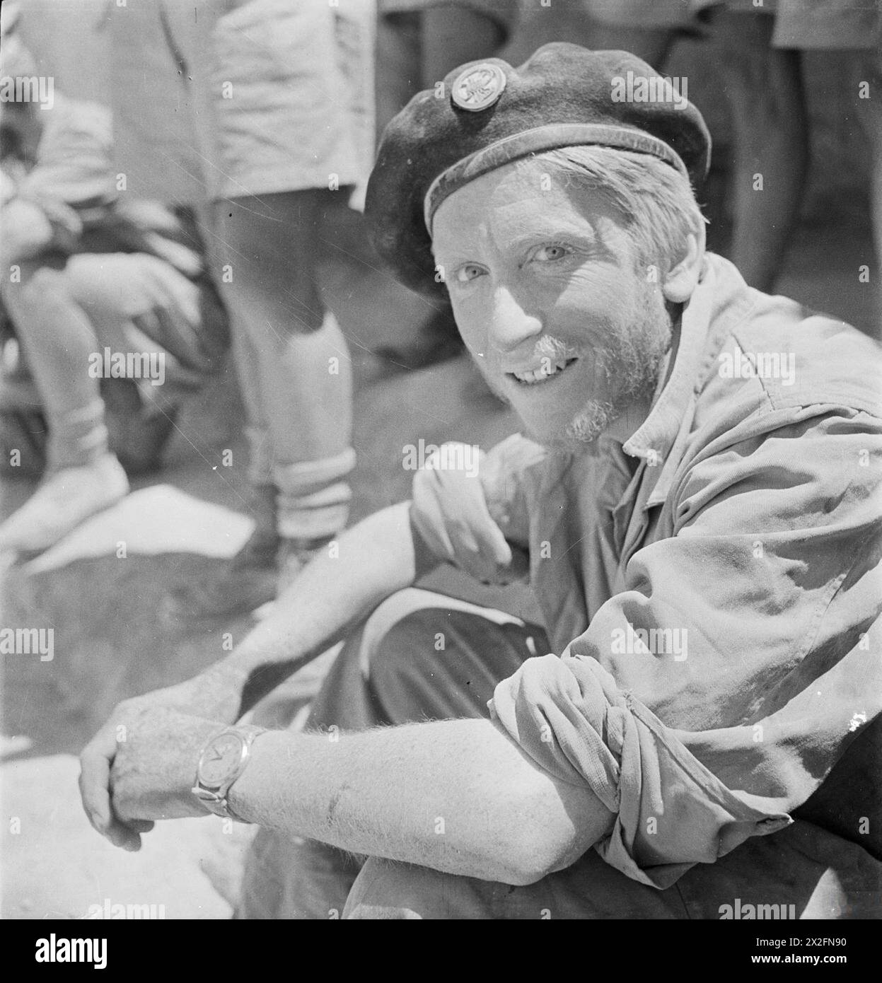Photograph showing a member of a Long Range Desert Group patrol resting ...