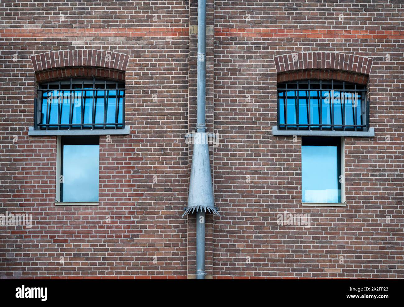 Exterior of an old prison building, brick wall and the windows with metal bars Stock Photo - Alamy