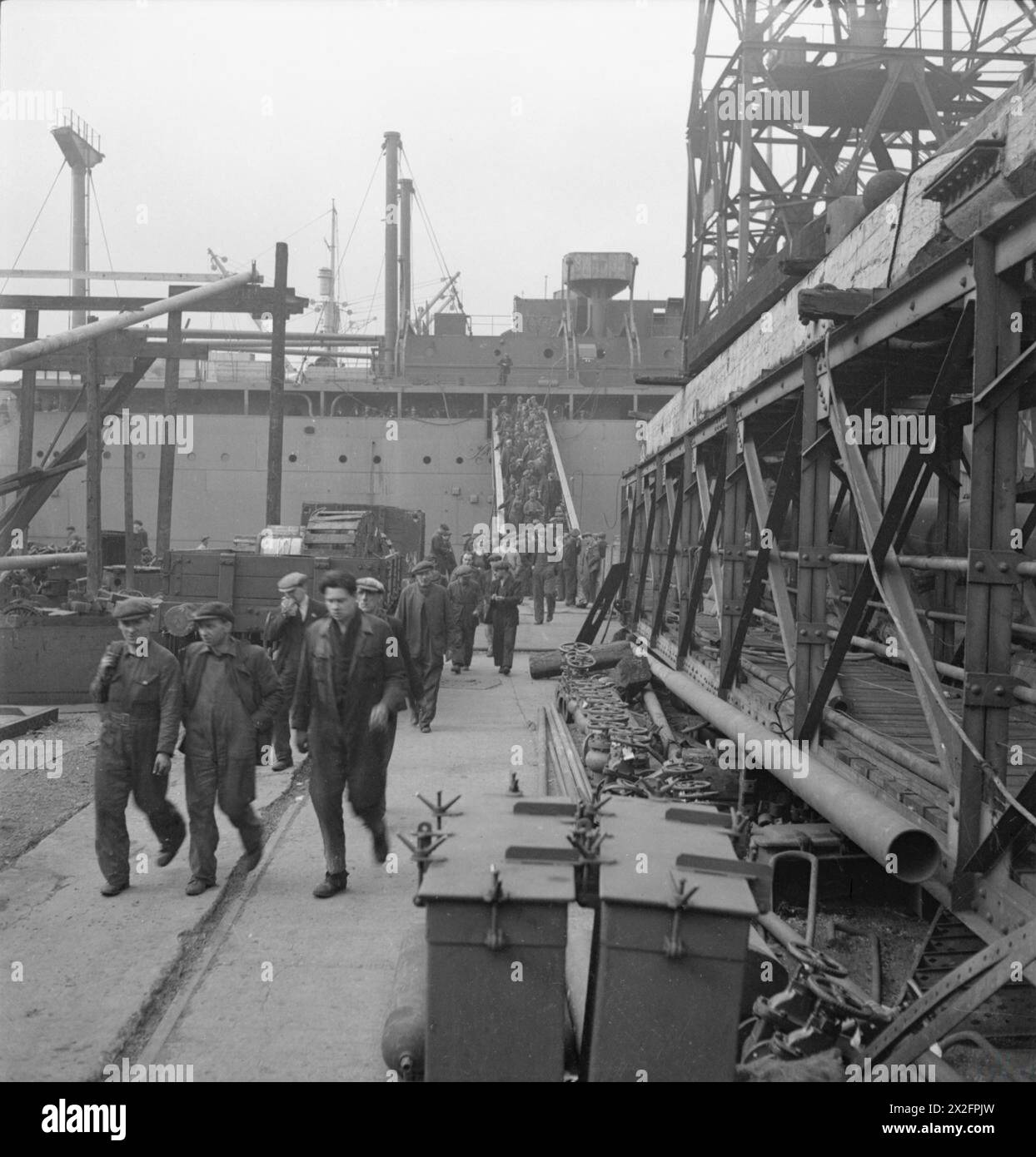 In 1943, Cecil Beaton photographed workers leaving a ship at the Tyne ...