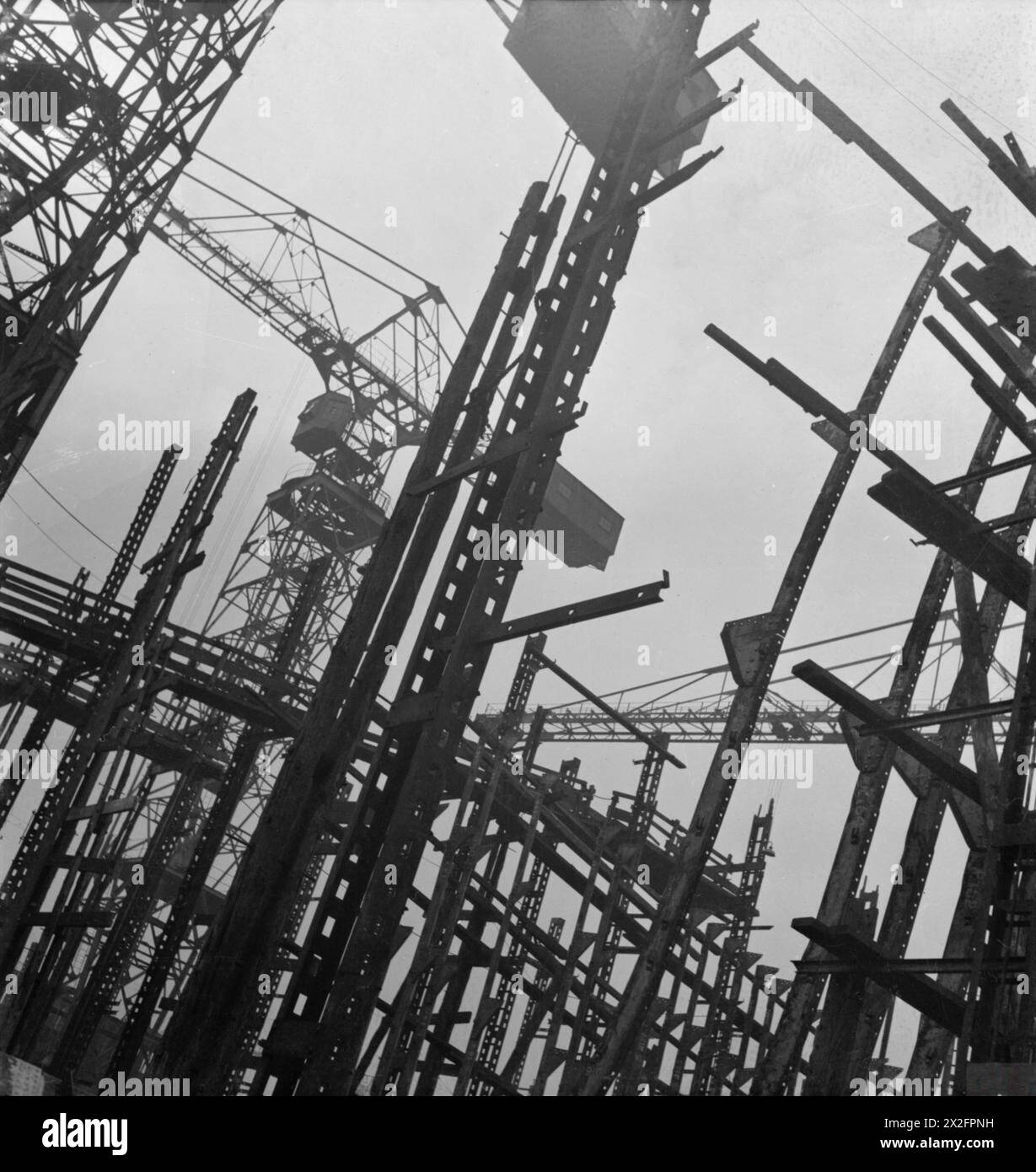 A 1943 photograph by Cecil Beaton capturing the large stocks and cranes ...
