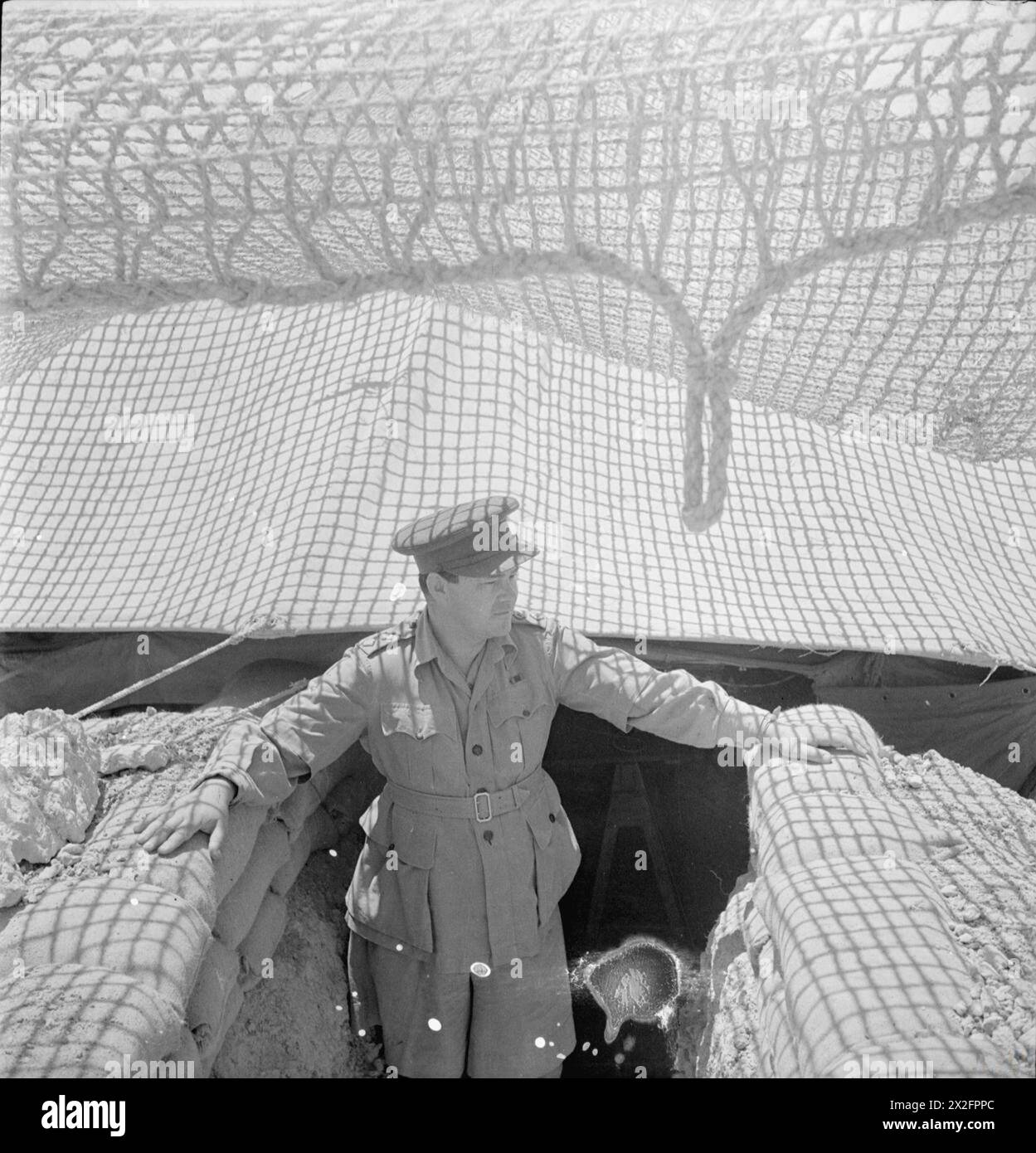 Cecil Beaton photographed a Brigadier General positioned under ...