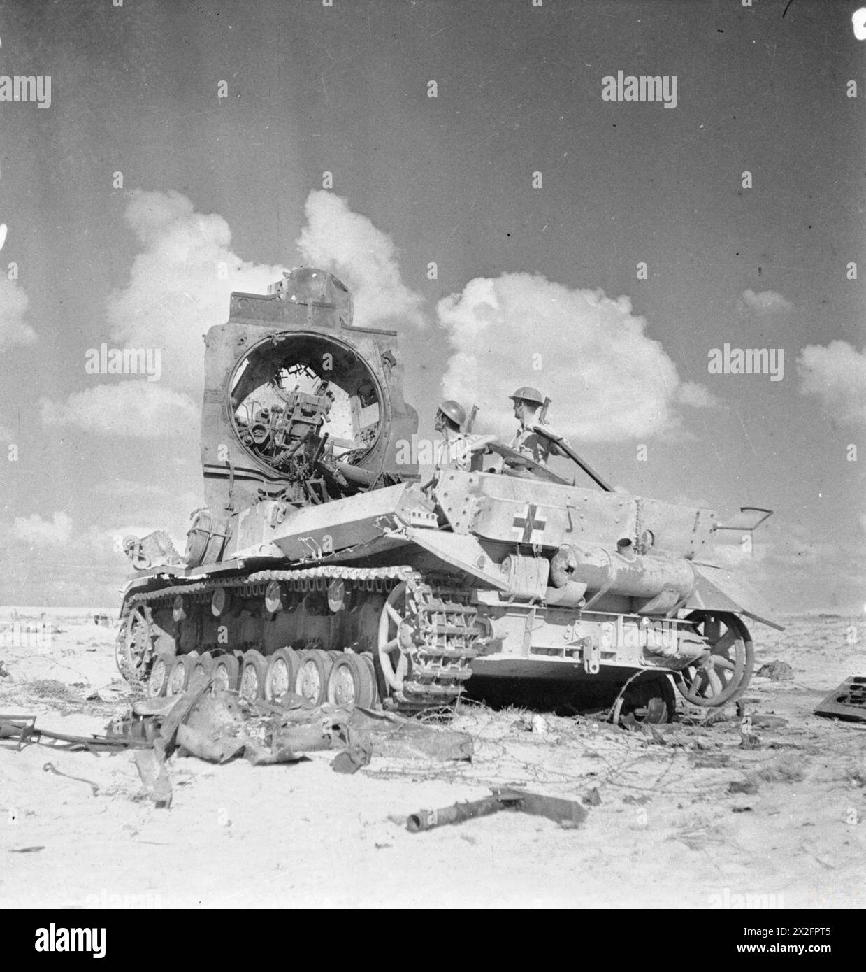 THE BRITISH ARMY IN NORTH AFRICA 1942 - Infantrymen examine the remains of a knocked-out German ...