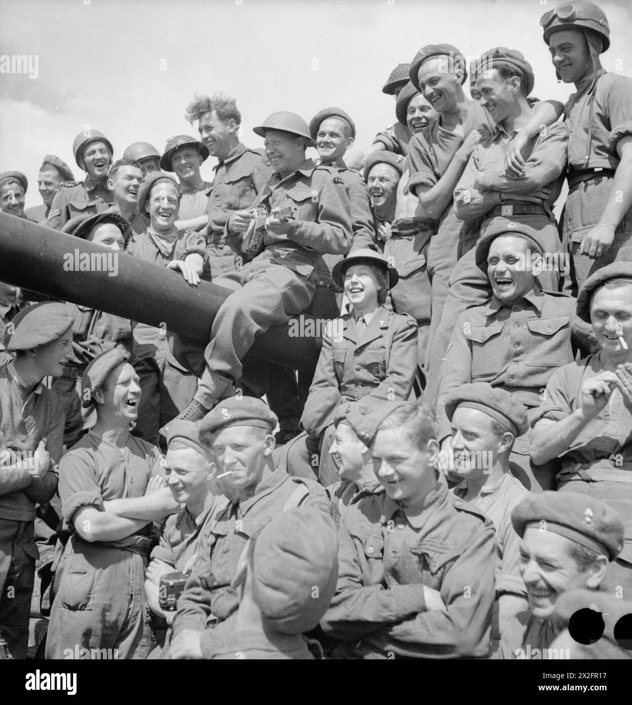 GEORGE FORMBY IN NORMANDY - Sitting astride a gun barrel George Formby ...
