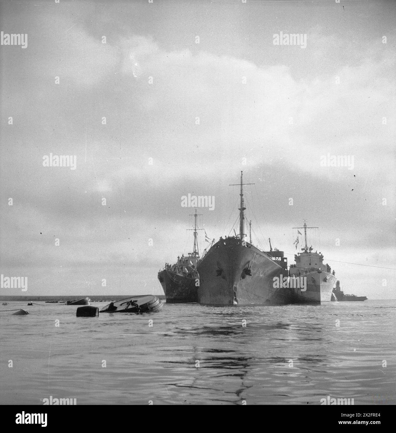 The damaged tanker OHIO, supported by Royal Navy destroyers HMS Penn ...