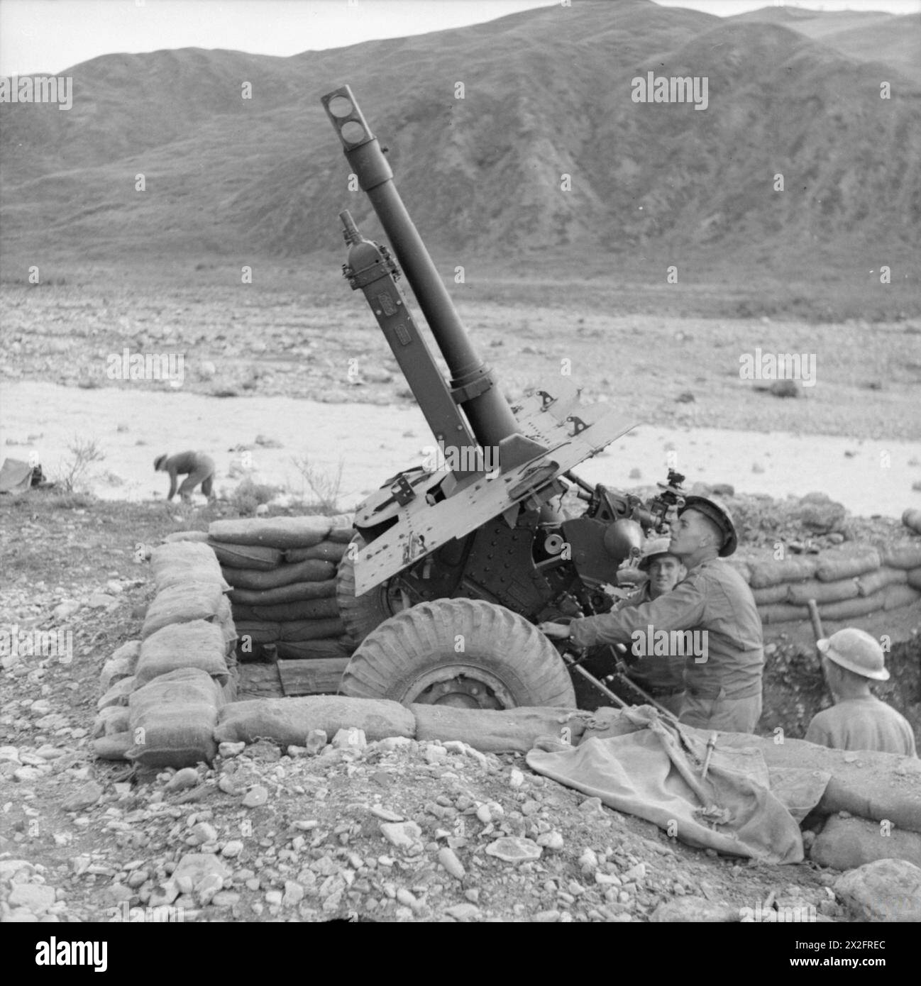 A 25-pounder gun of 266 Battery, 67th Field Regiment, is used as a ...