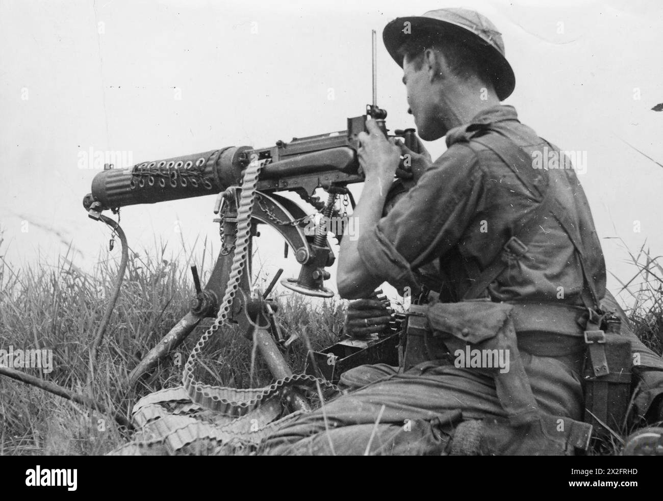 THE BRITISH ARMY IN BURMA 1944 - A soldier of the 2nd Battalion, East Lancashire Regiment, fires ...