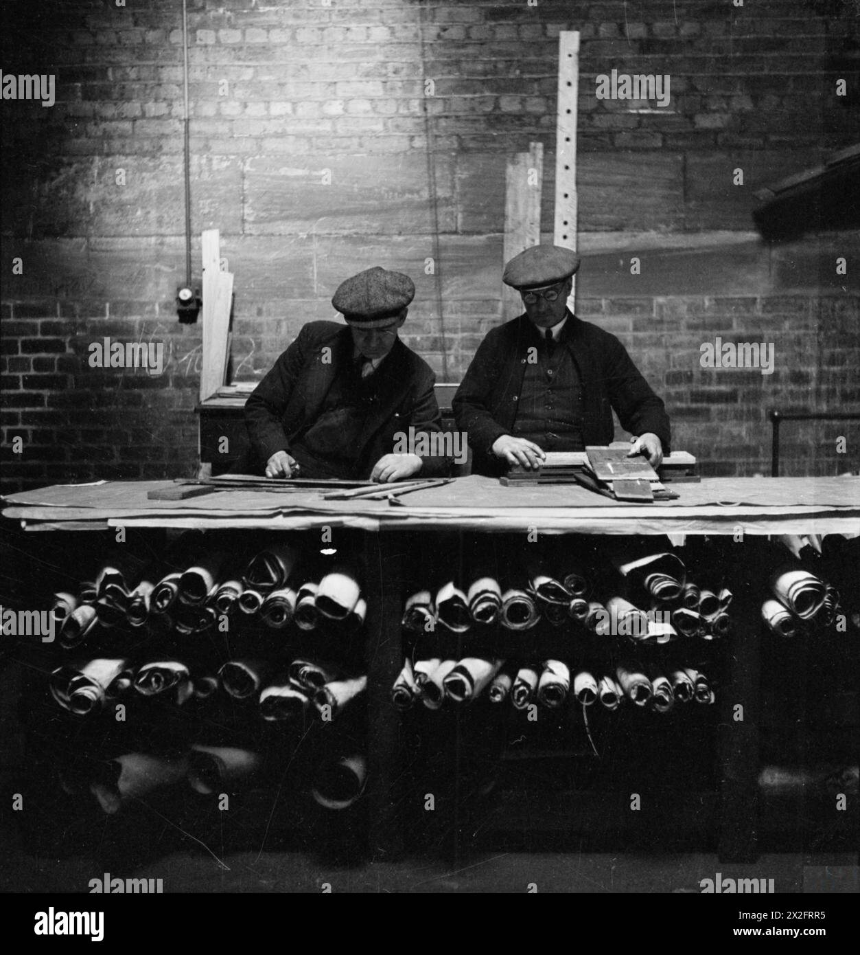 Two men work with ship plans in the mould loft at Tyneside Shipyards in ...