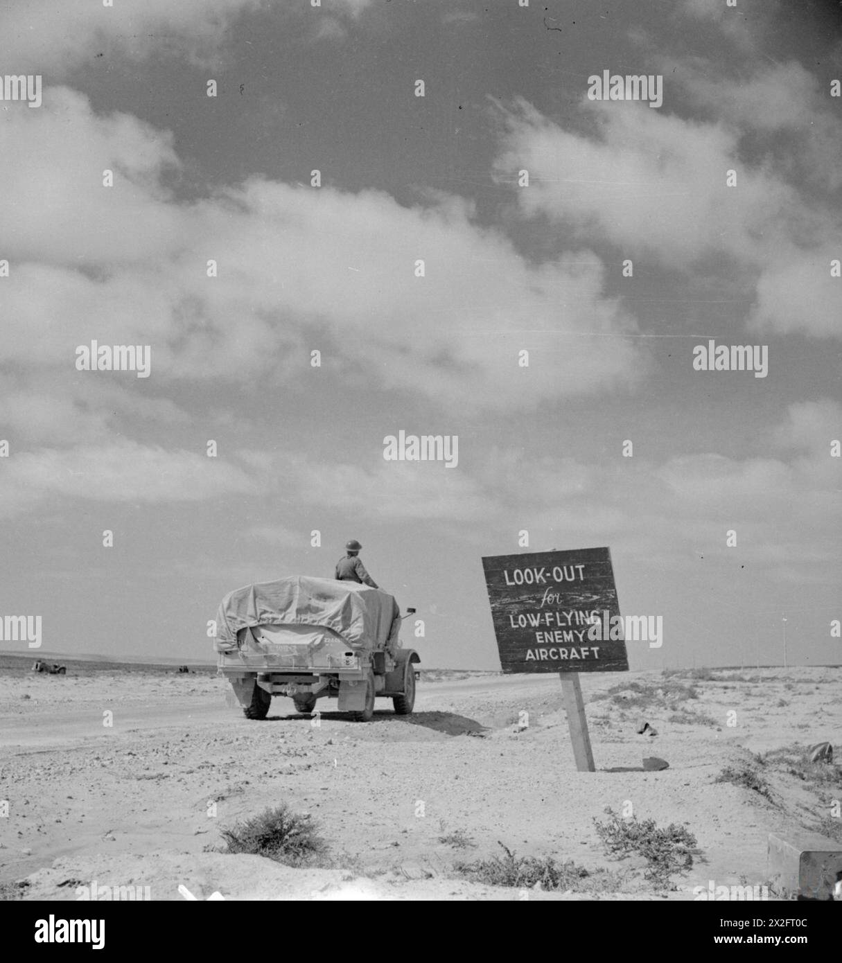 A lorry passes a sign warning of low-flying enemy aircraft in the ...