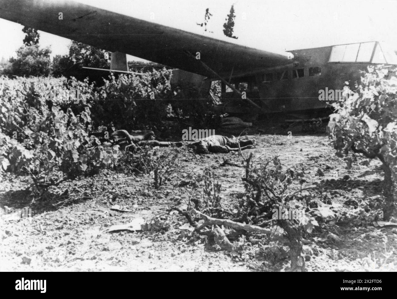 THE BATTLE FOR CRETE, MAY 1941 - A crashed German glider with two of ...