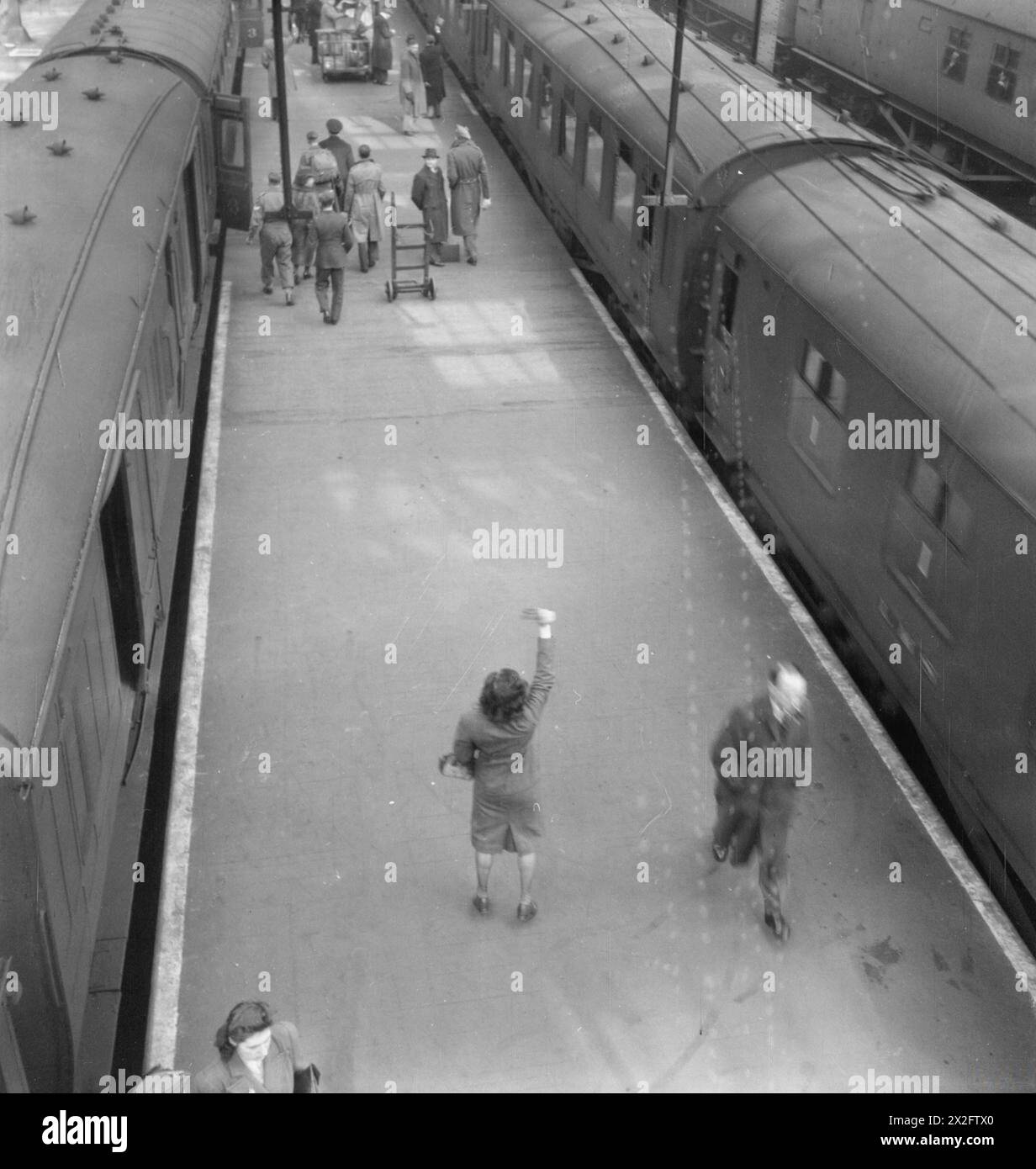 At Euston Station during wartime, women are shown waving goodbye on the ...