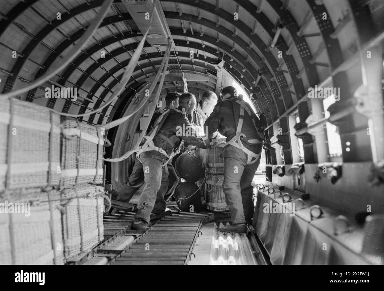 Men of a Royal Army Service Corps Despatch Unit prepare to drop ...