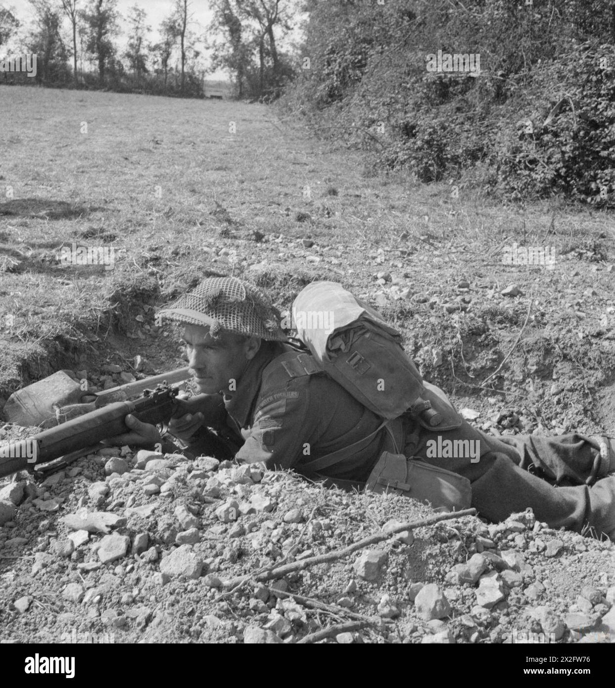 THE BRITISH ARMY IN NORTH-WEST EUROPE 1944-1945 - A soldier in a slit ...