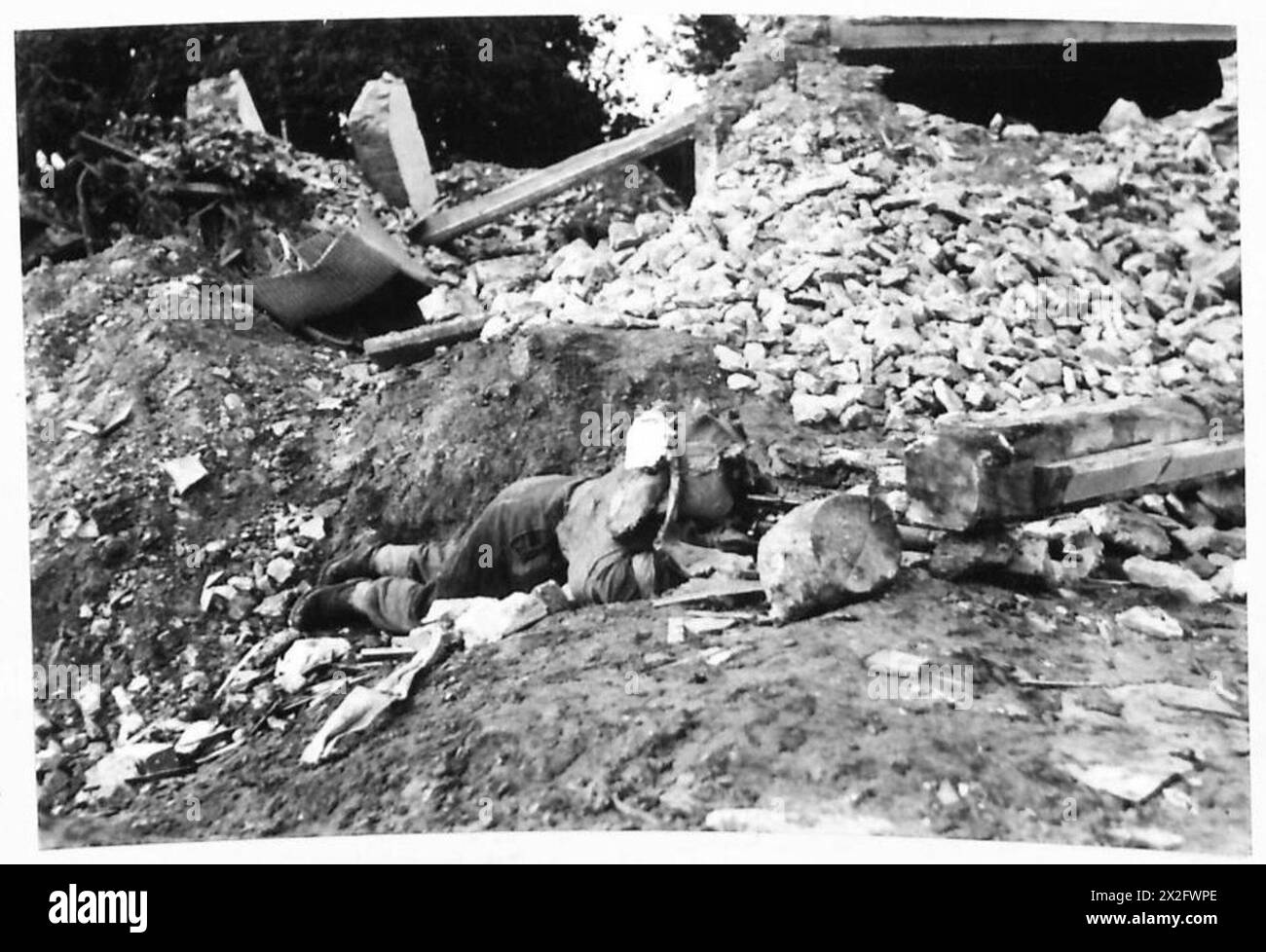 SCHOOL FOR SNIPERS - A sniper in position in the rubble of a demolished ...