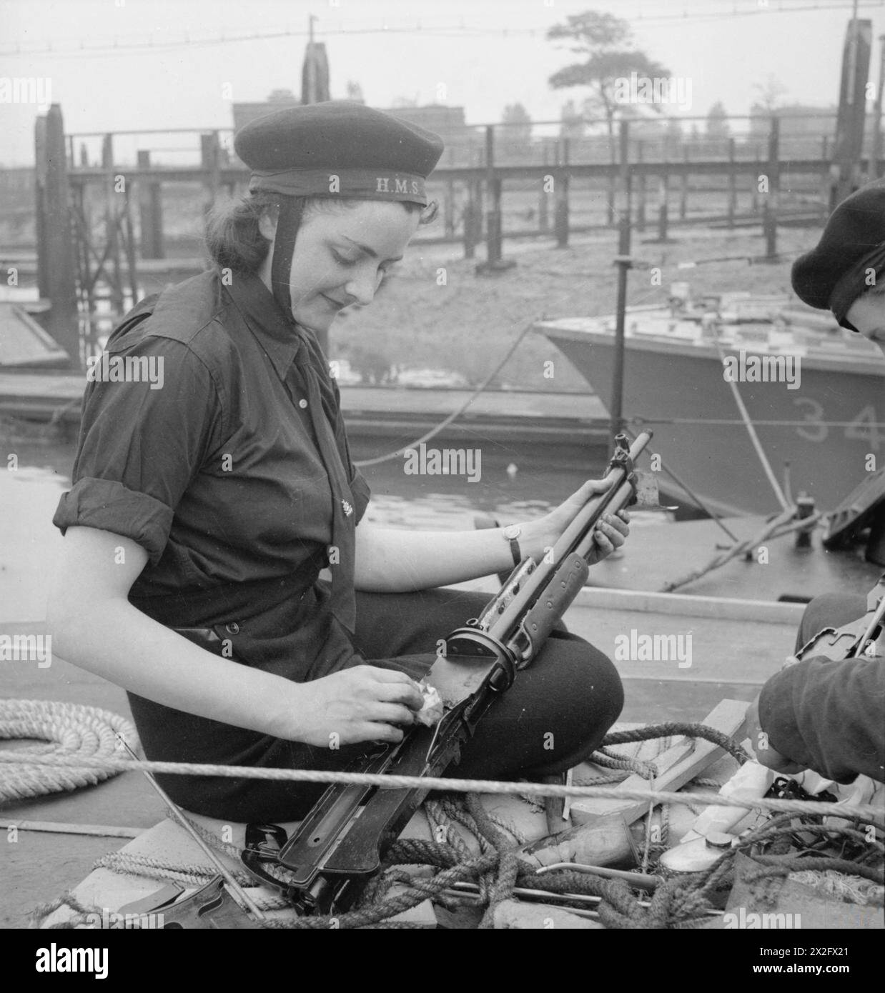 WOMEN'S ROYAL NAVAL SERVICE. MAINTENANCE WRENS MAINTAIN SMALL ARMS UP ...