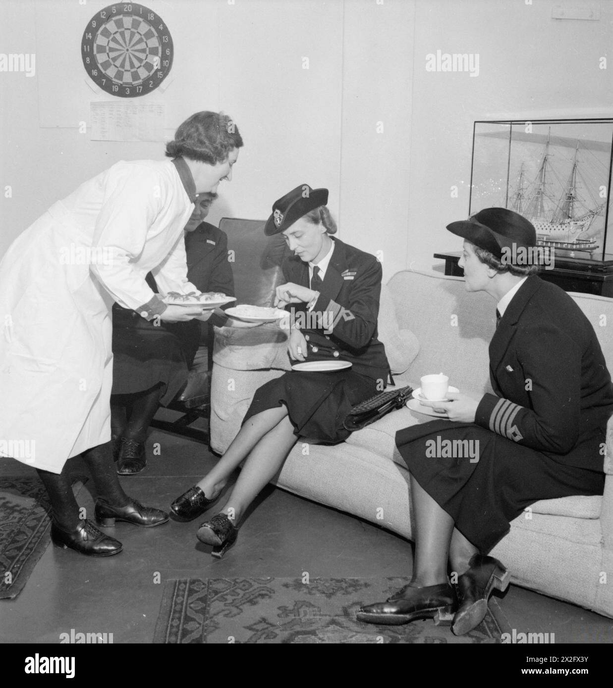 HRH the Duchess of Kent, Commandant of the WRNS, samples food prepared ...