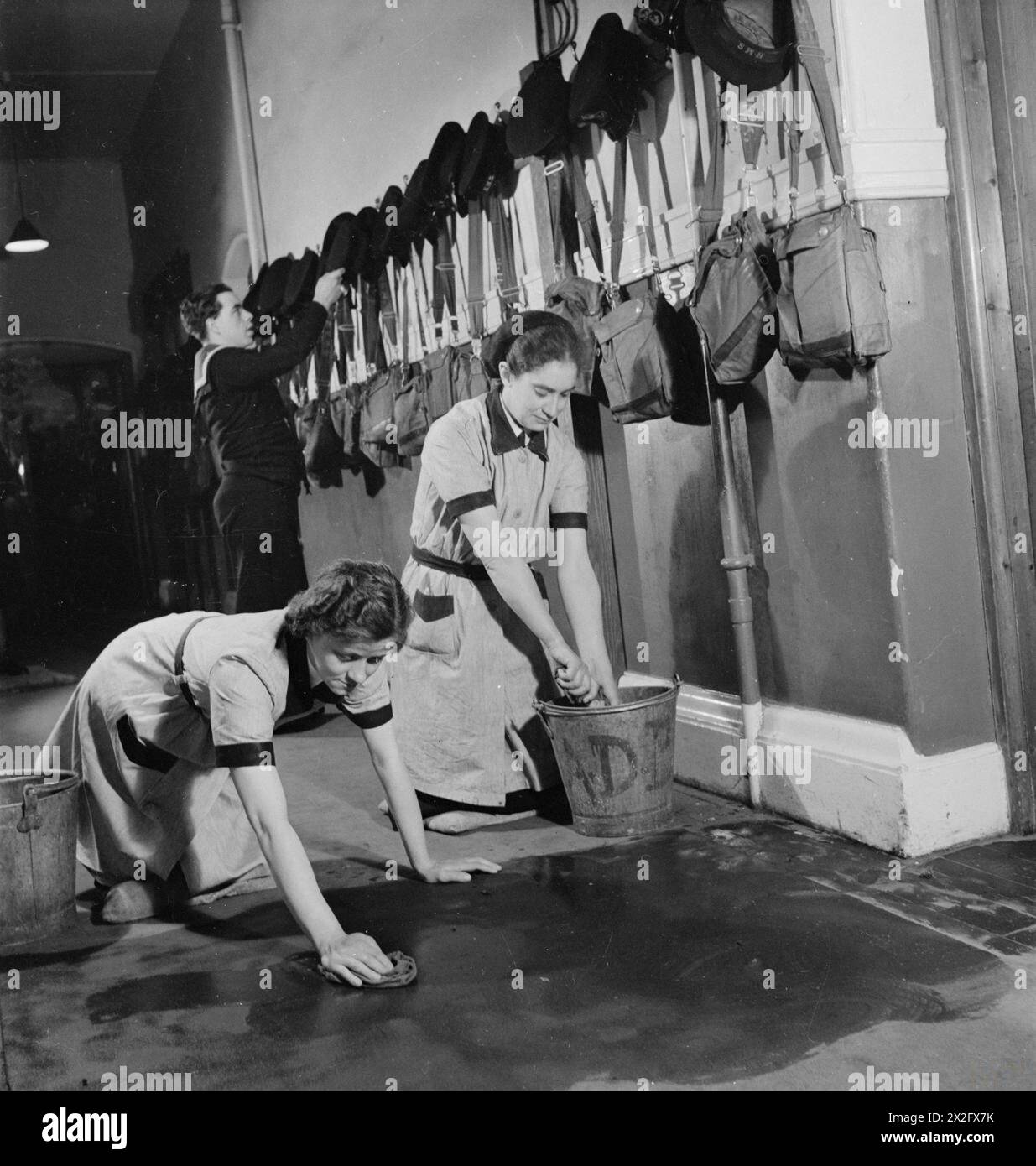 WOMEN'S ROYAL NAVAL SERVICE. - Wren stewards cleaning the floor Stock ...