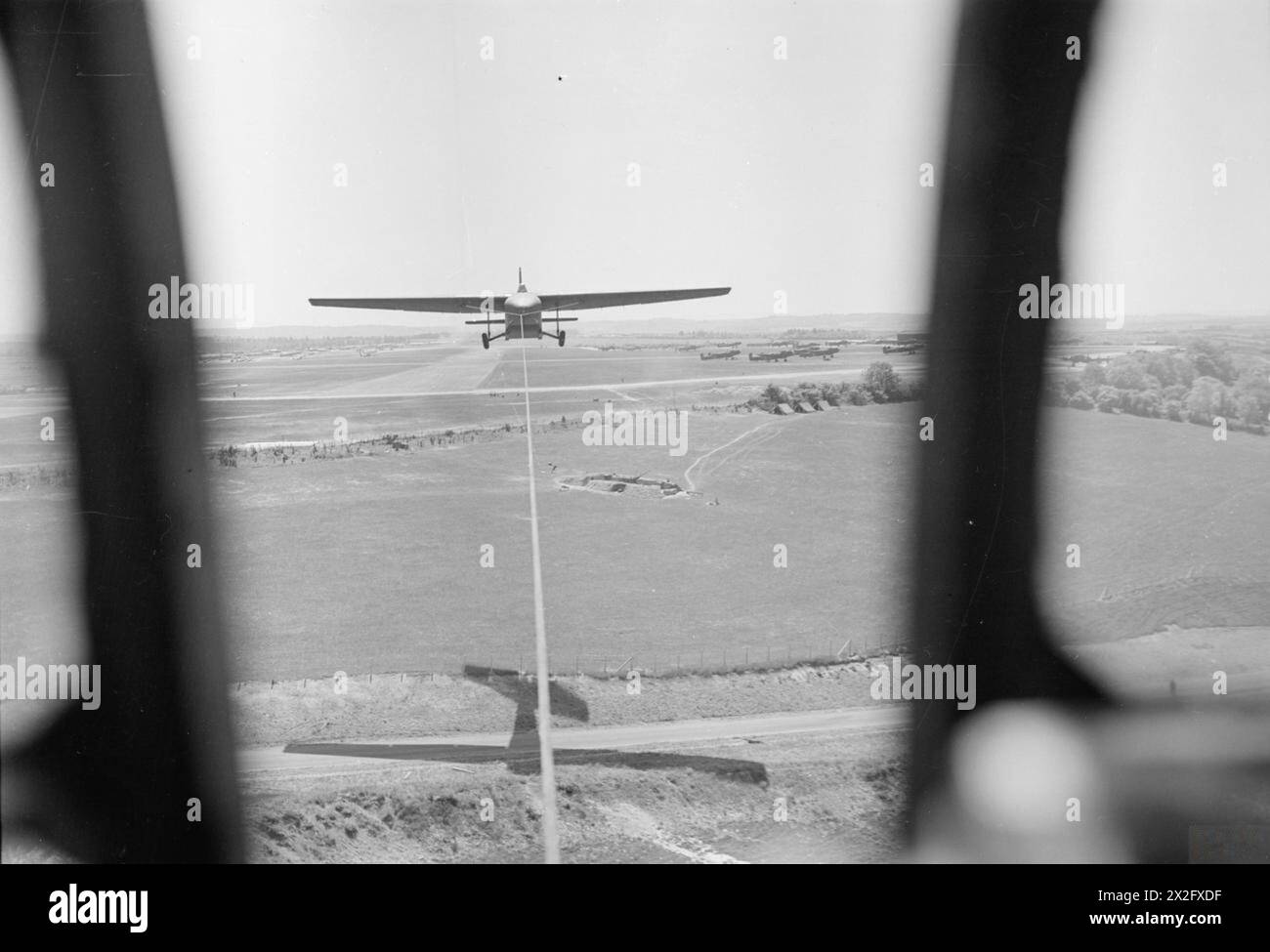 A GAL Hamilcar heavy glider is towed off Runway 19 at Tarrant Rushton ...