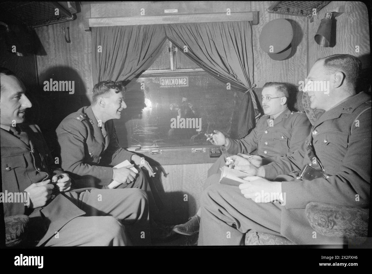 British Army officers travel between London and Scotland in 1944 on a ...