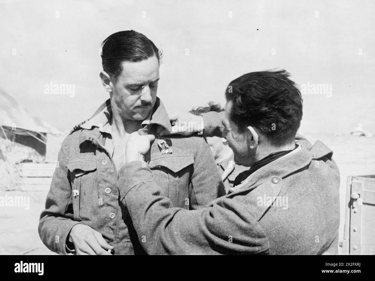 Polish officer awards Polish wings to Squadron Leader Clive Caldwell of ...