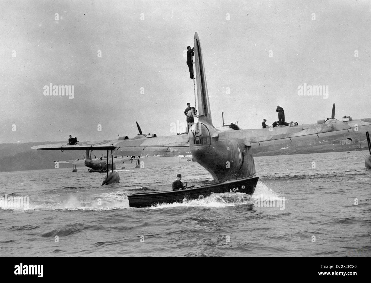 ROYAL AIR FORCE COASTAL COMMAND, 1939-1945. - An airman steers an 18 ...