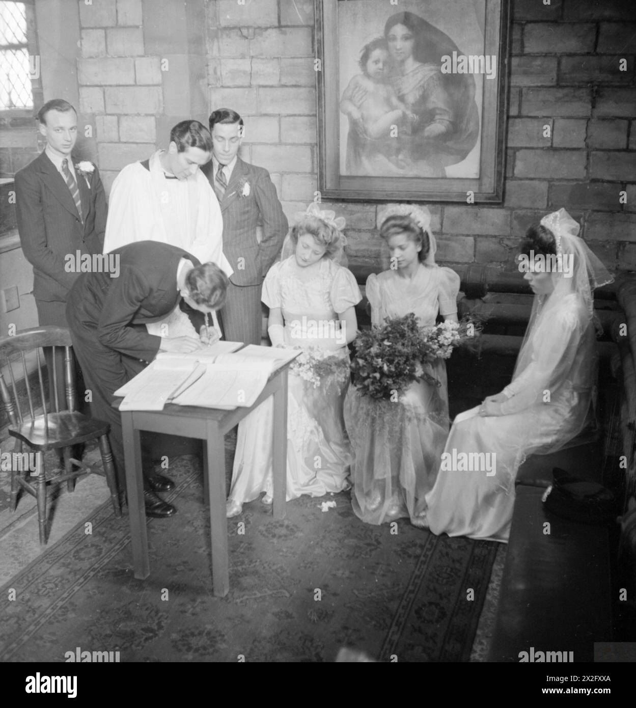 Reverend Joseph Stephens oversees the signing of the register at St ...