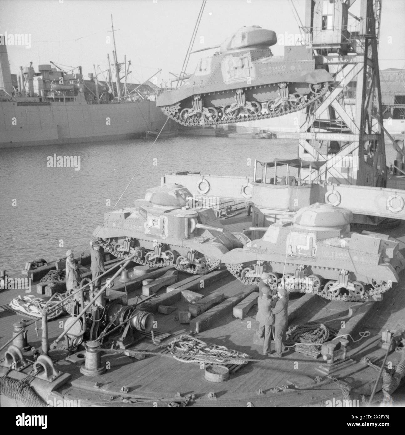American M3 Grant tanks are unloaded from ships at a British port on 29 ...
