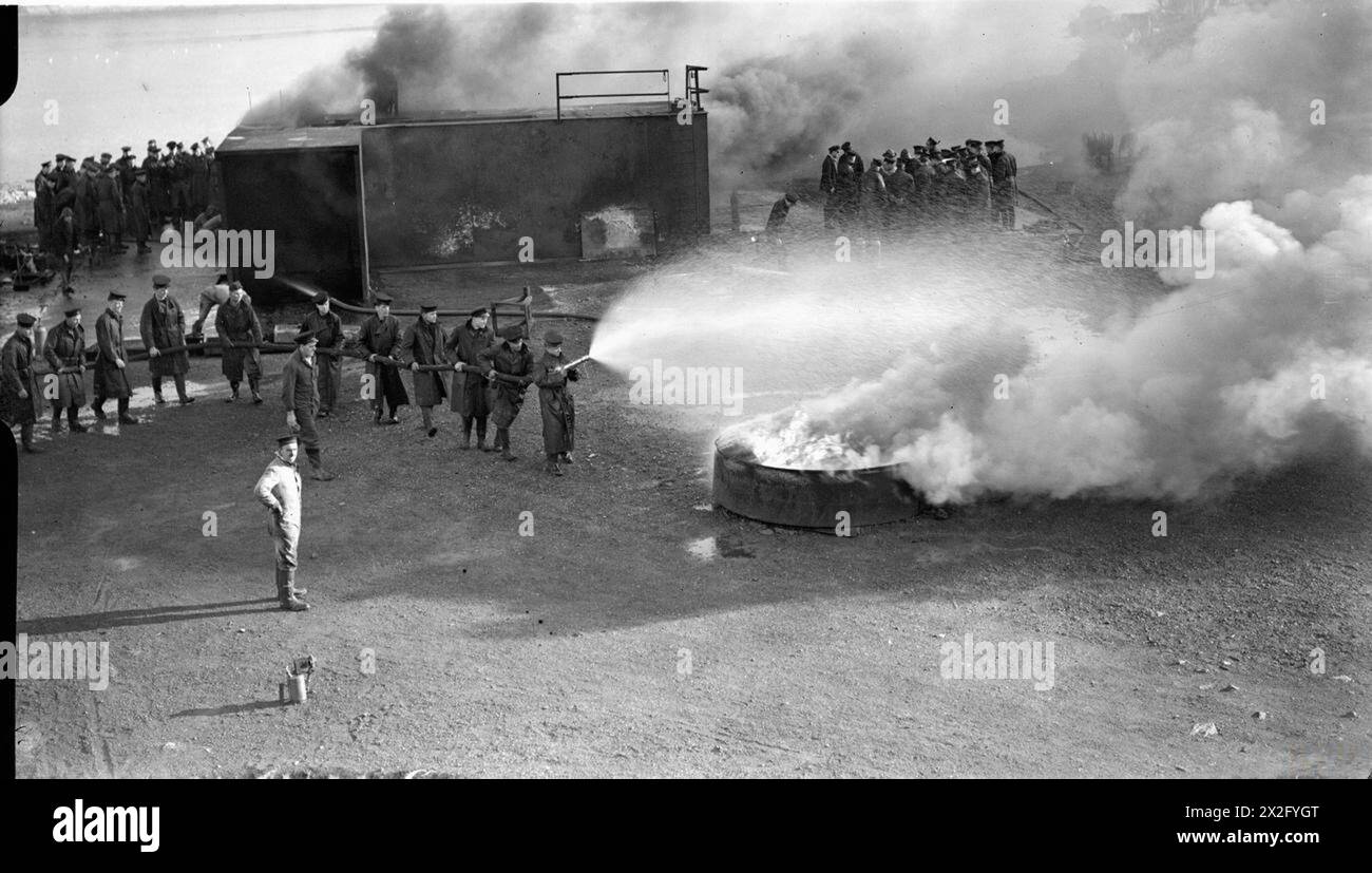 THE ROYAL NAVY DURING THE SECOND WORLD WAR - A class extinguishing a blazing oil fuel tank by ...