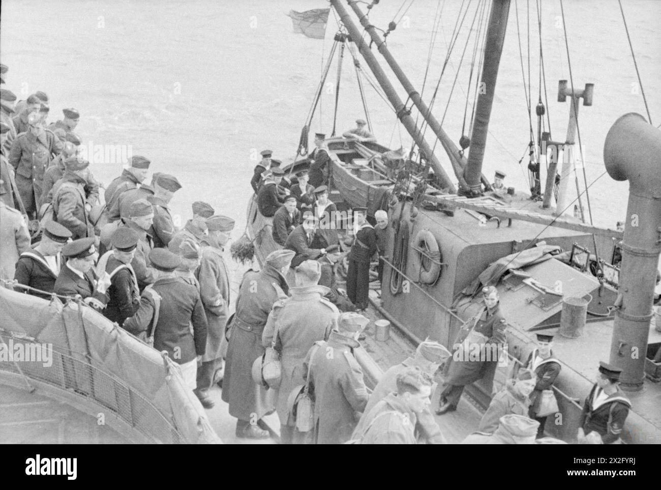 Soldiers and airmen are transported to a destroyer at sea for a ...