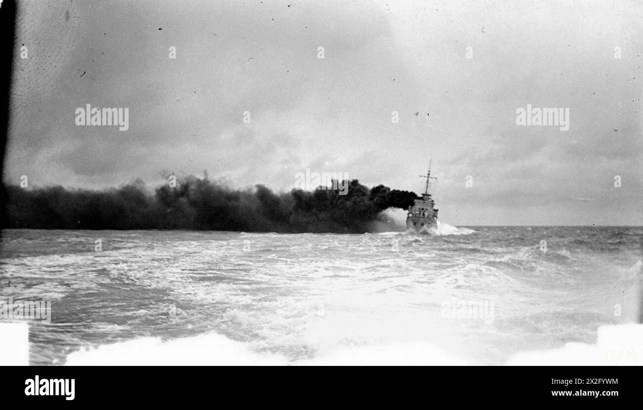 Hunt class destroyer HMS Meynell generates a smoke screen aboard HMS ...