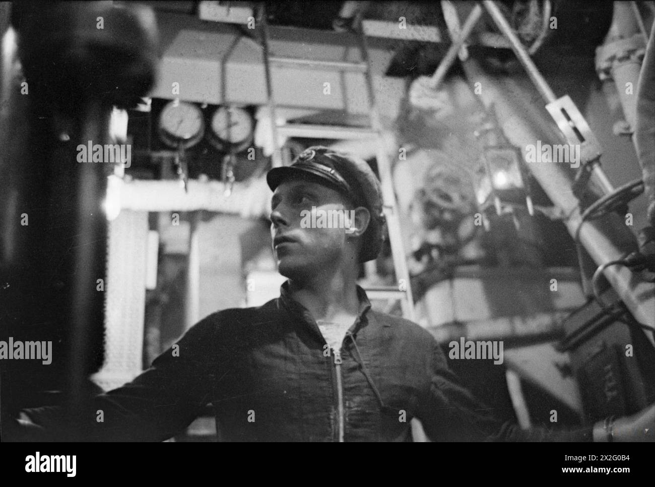 Stokers monitor boilers in the boiler room of HMS Javelin in August ...