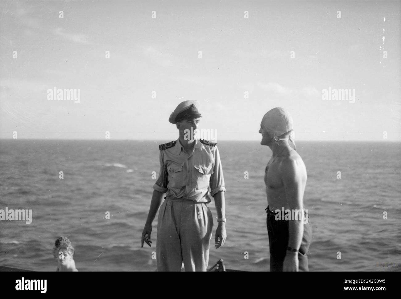WITH HMS INDOMITABLE. AUGUST 1944, ON BOARD THE AIRCRAFT CARRIER AS SHE ...