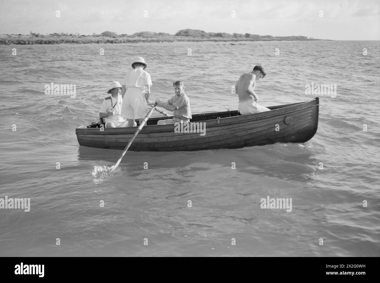 Rear Admiral A D Read is rowed ashore while the cruiser HMS Newcastle ...