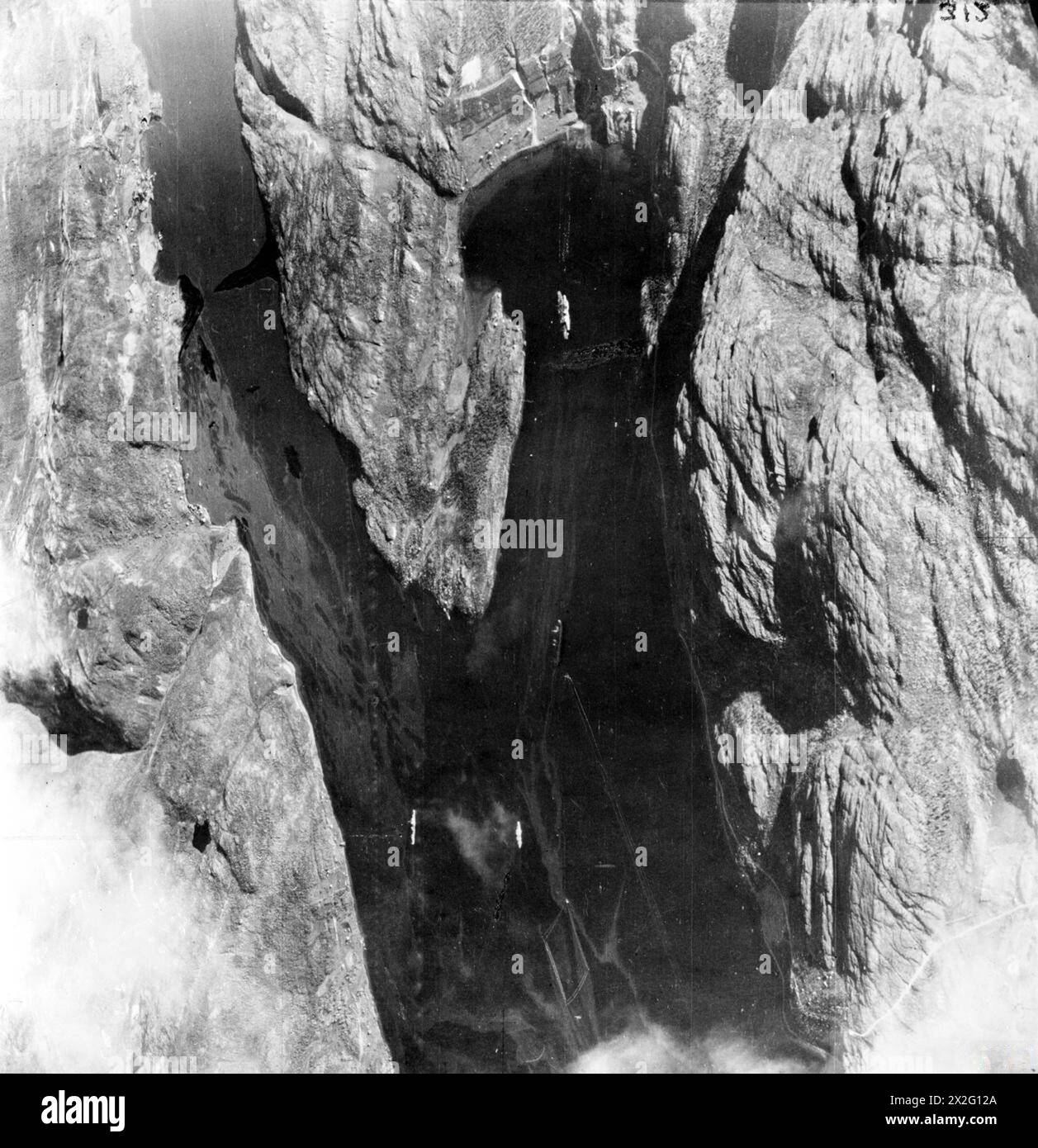 Aerial photograph of Alten Fjord showing the battleship Tirpitz and ...