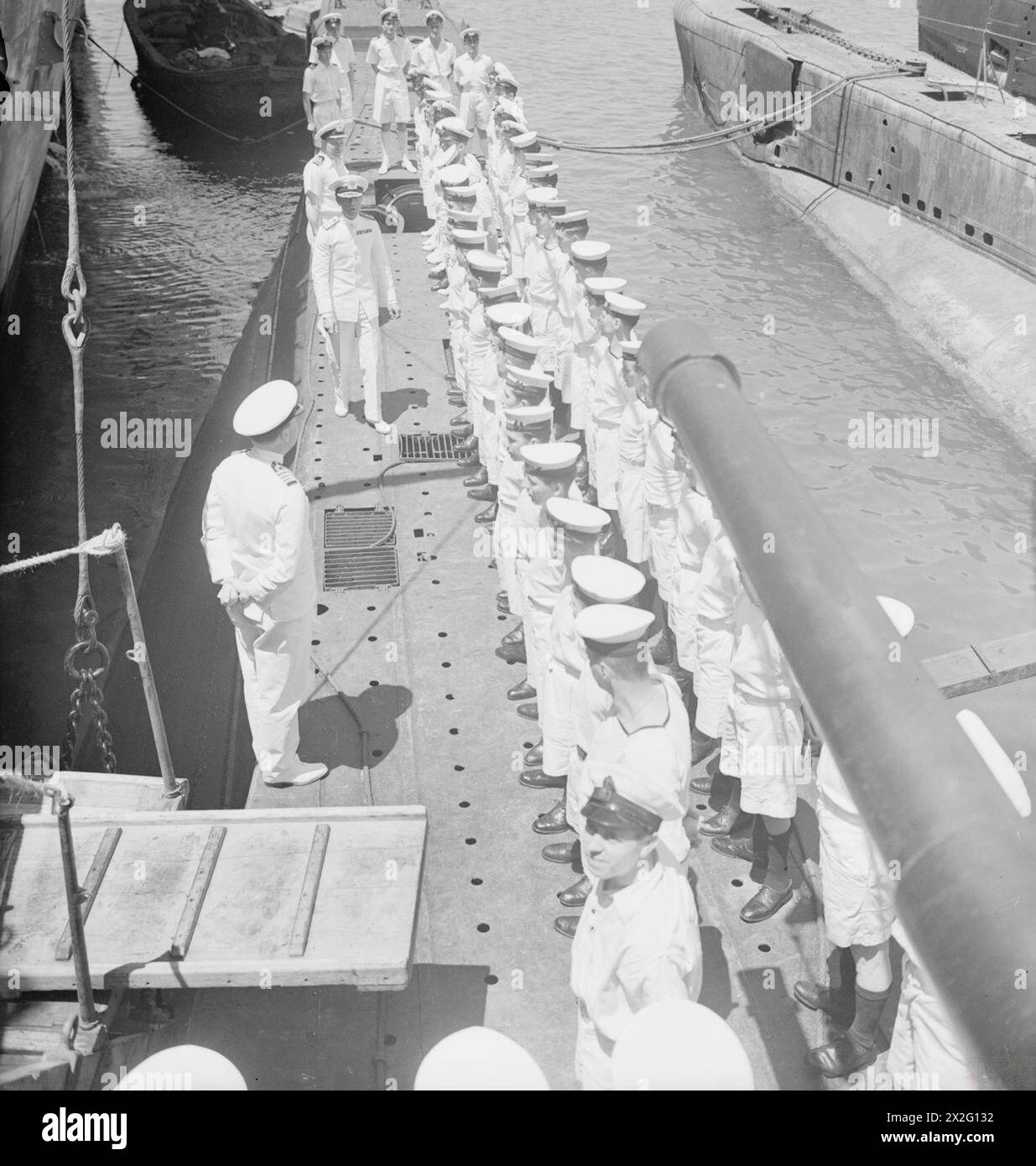 Rear Admiral Sir P. Vian bids farewell to Commander A.C.C. Miers and ...