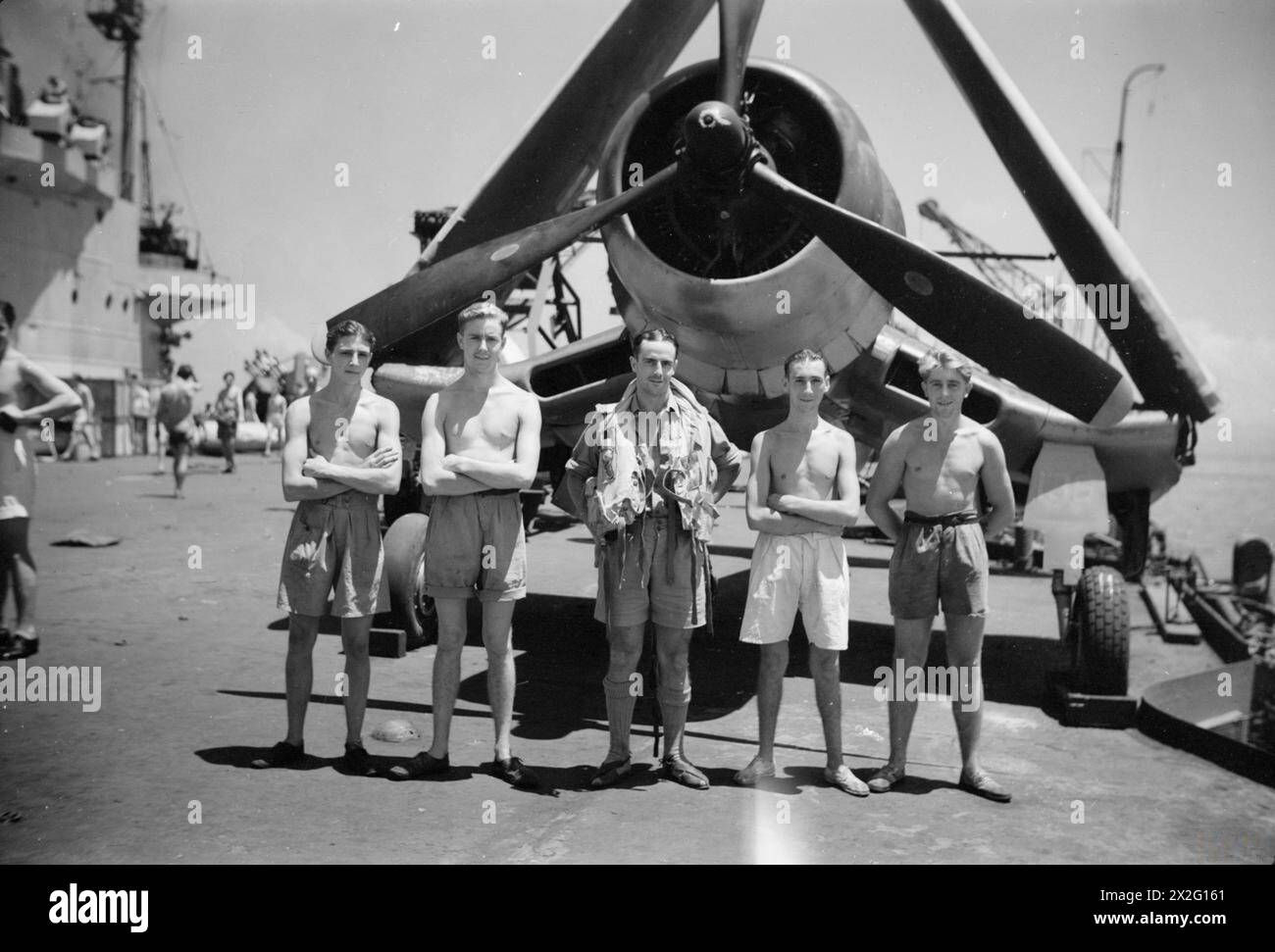 Sub Lieut (A) F B Heffer of RNZNVR and maintenance crew serve aboard ...