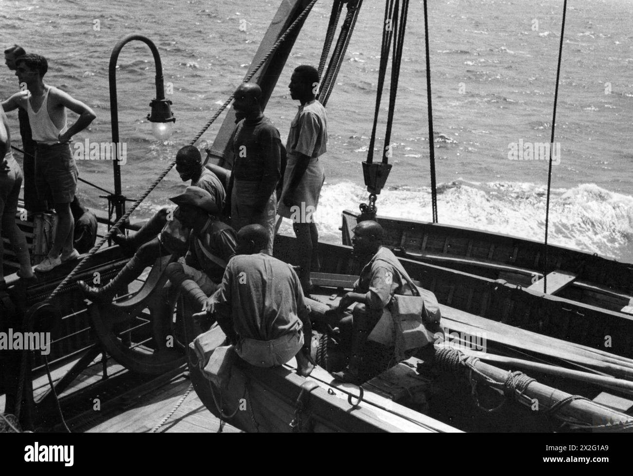 ON BOARD TROOP TRANSPORTS AT SEA. AUGUST 1941, ON AN AFRICAN TROOP ...