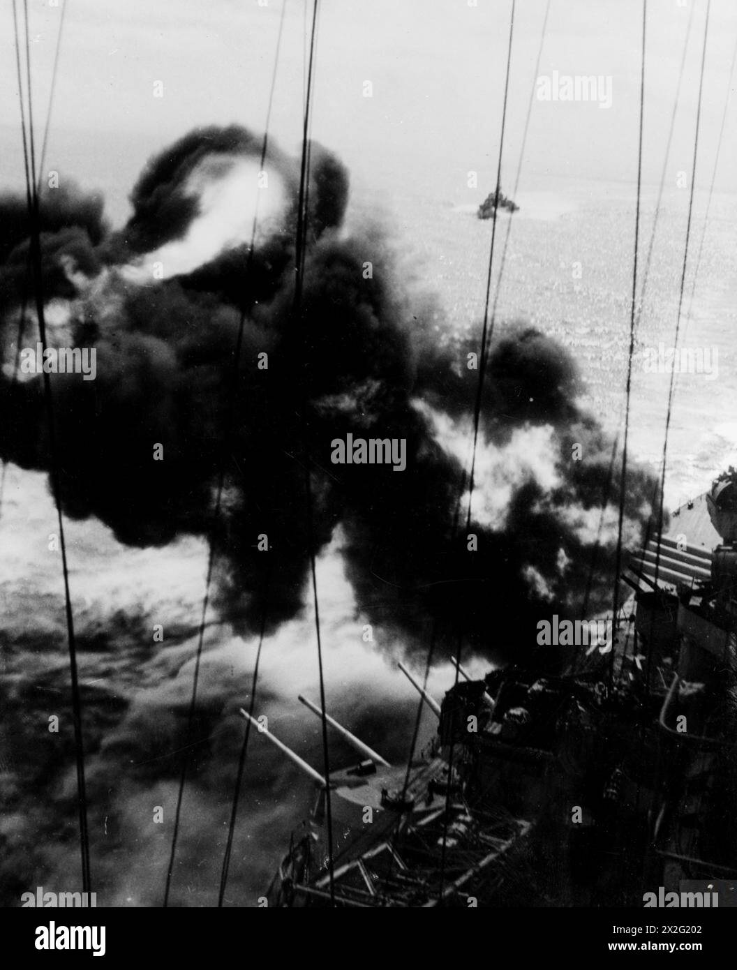 HMS Howe, flagship of Admiral Bruce Fraser in January 1945, fires its ...