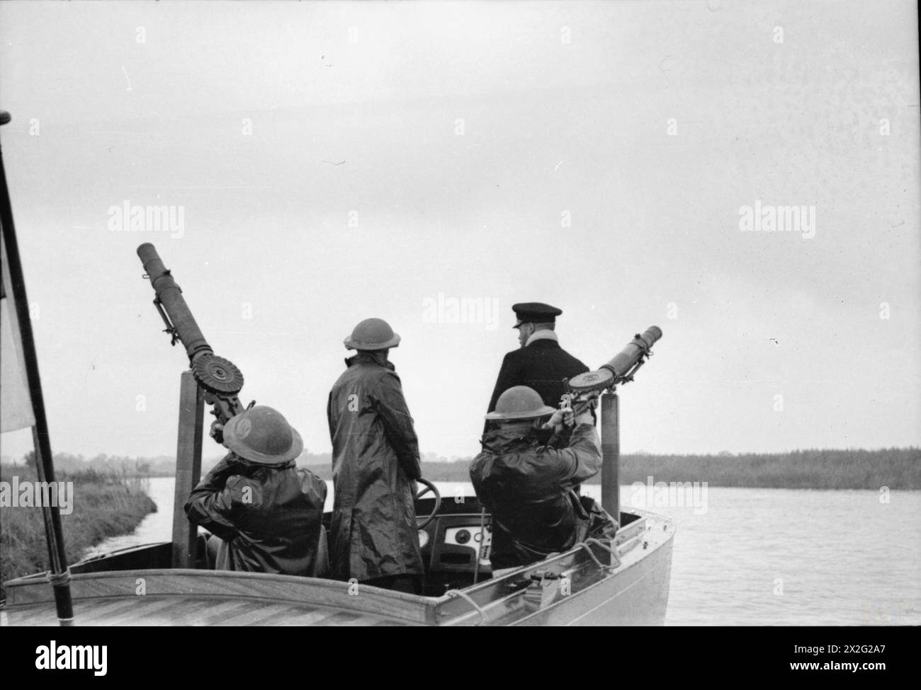 In 1940, Norfolk Broads flotilla gunners operate Lewis guns and monitor ...