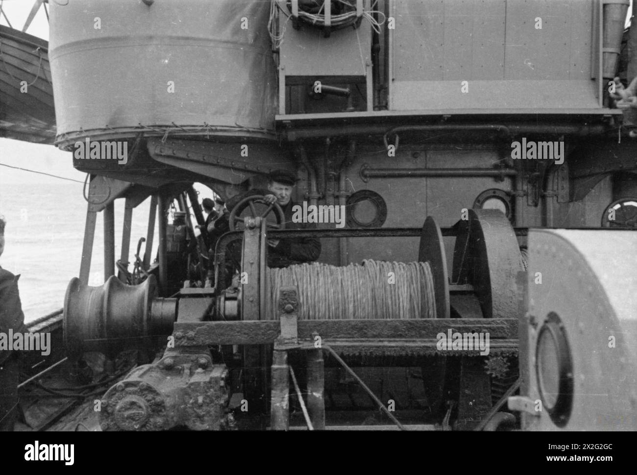 MINESWEEPERS AT WORK. 1940, OR 1941, ON BOARD A MINESWEEPER AT SEA ...