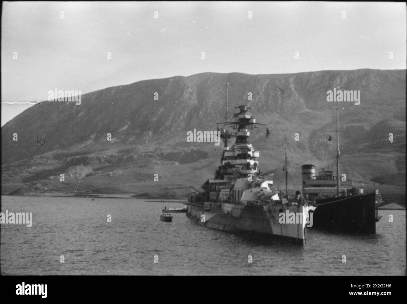 The battleship HMS Barham performs oiling operations in Suda Bay ...