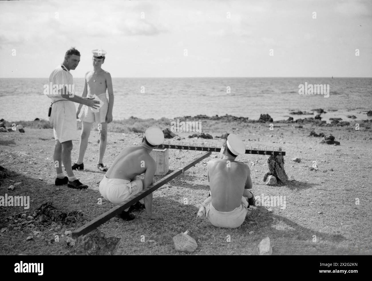 EASTERN FLEET GUNS PREPARE, A CRUISER CALIBRATING HER GUNS. 3 APRIL ...