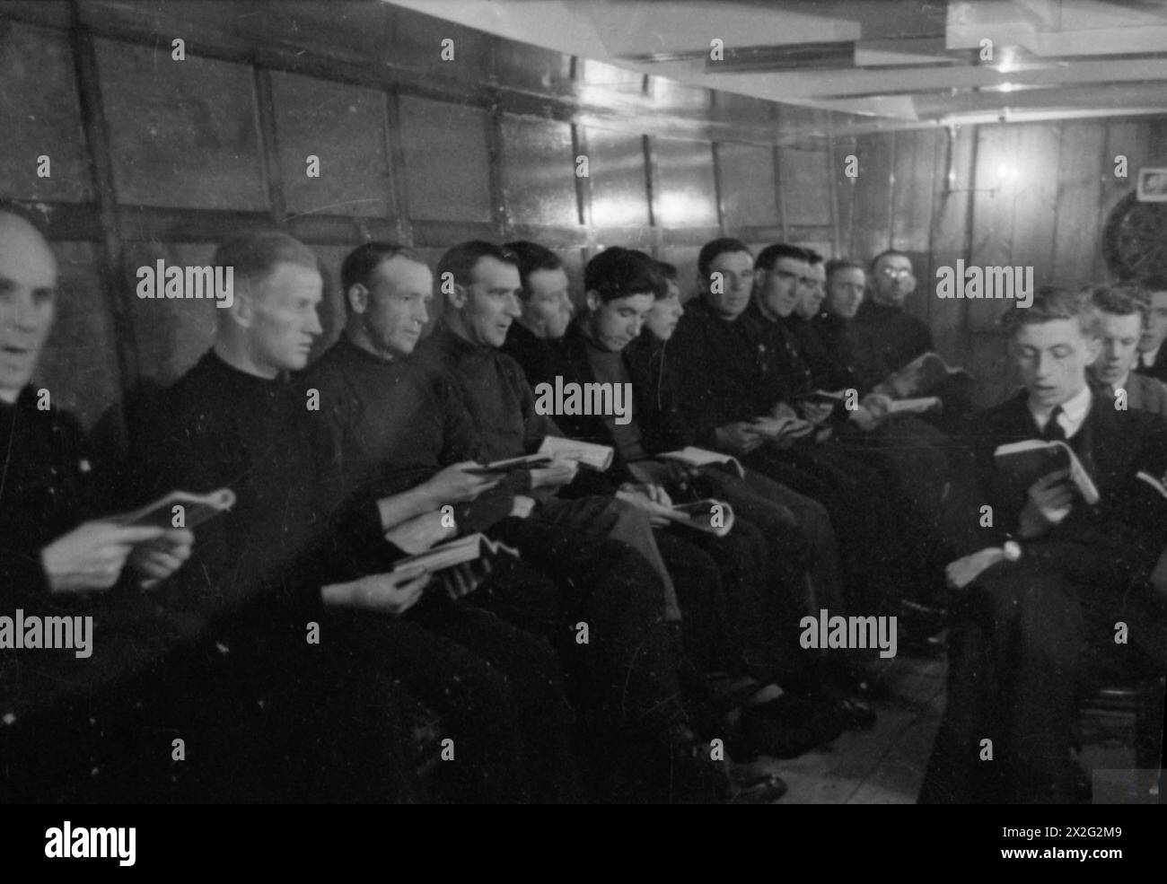 Driftermen of the Royal Navy serve on board drifters at Scapa in September 1941, transporting ...