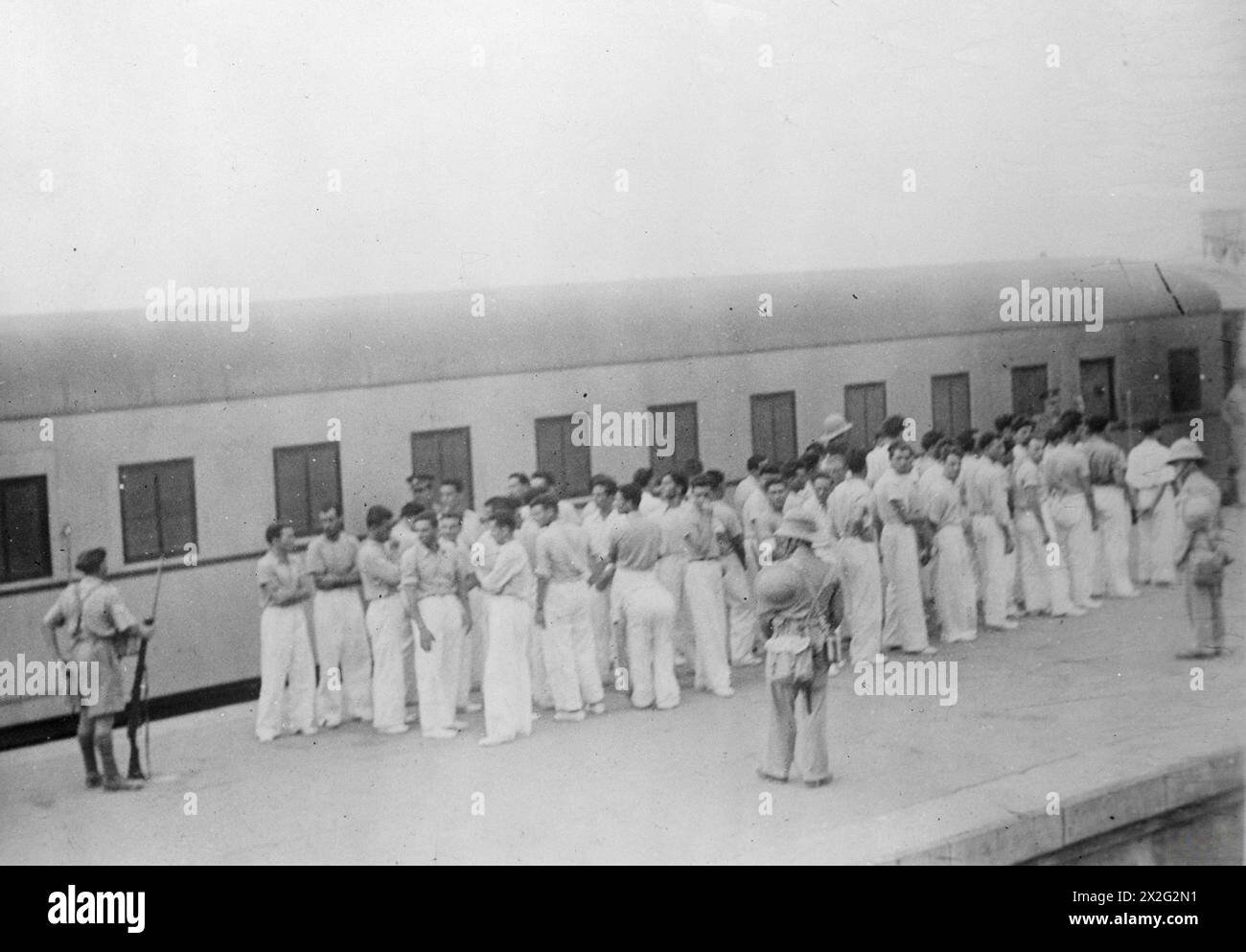 Prisoners under guard hi-res stock photography and images - Alamy